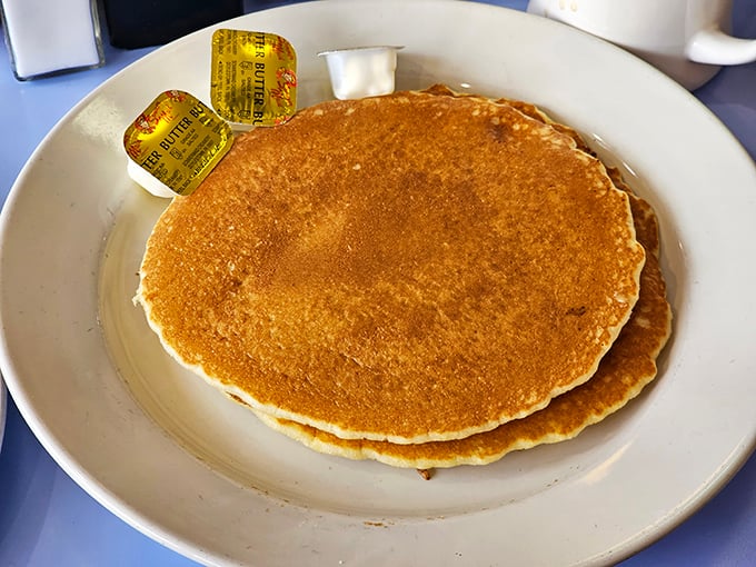 Golden-brown pancakes that span the plate's horizon – the breakfast equivalent of a warm hug from your favorite aunt.