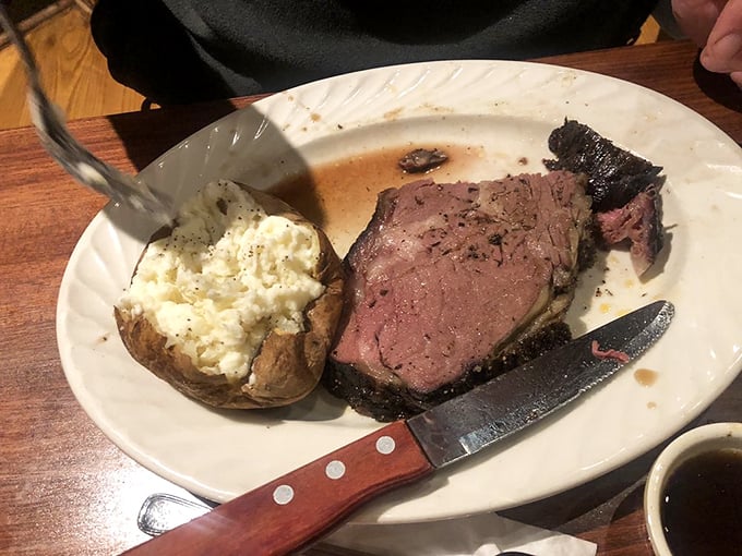 This prime rib doesn't just melt in your mouth—it practically serenades your taste buds while slow-dancing with that perfectly baked potato.