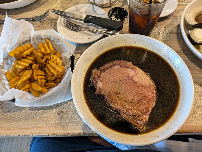 This isn't just prime rib—it's a masterclass in beef perfection. That rich au jus practically demands a moment of reverential silence.