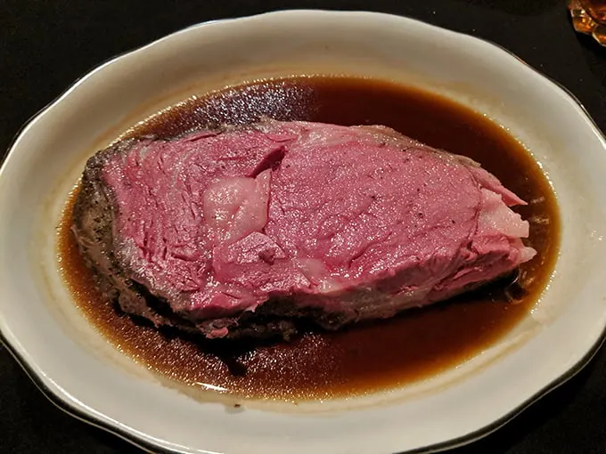 Prime rib so perfectly pink it could make a vegetarian weep. Swimming in au jus that deserves its own swimming pool—I'd dive right in.