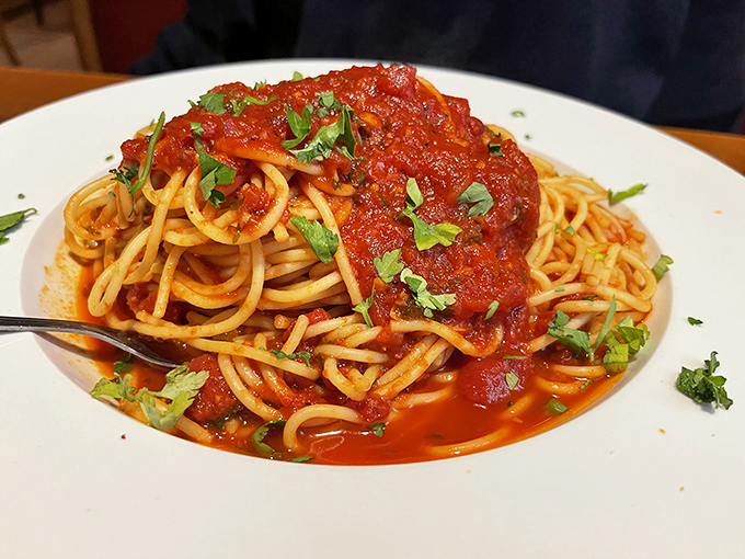 Spaghetti that doesn't need to show off—just perfectly cooked pasta swimming in a vibrant sauce that whispers, "This is how it's done."