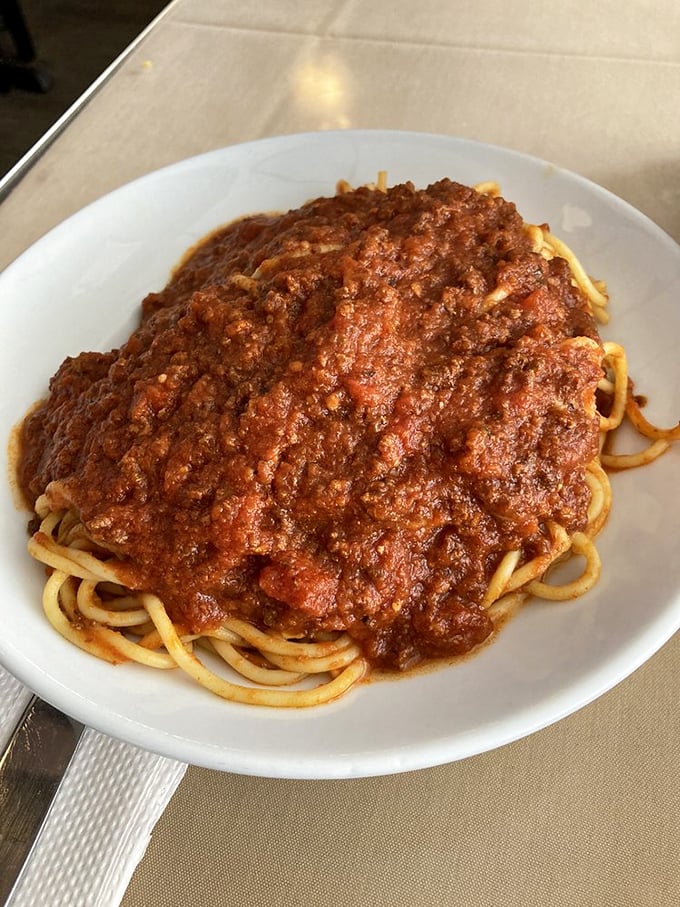 Spaghetti with meat sauce so generous it creates its own gravitational pull. This isn't a topping—it's a magnificent meat blanket.