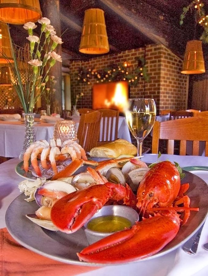 Behold the crown jewel of the ocean! This whole lobster isn't just dinner—it's a theatrical performance with a supporting cast of fresh clams.