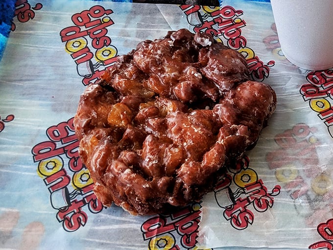 Behold the legendary apple fritter – a topographical marvel of crispy peaks and valleys hiding pockets of cinnamon-kissed apple treasures within.