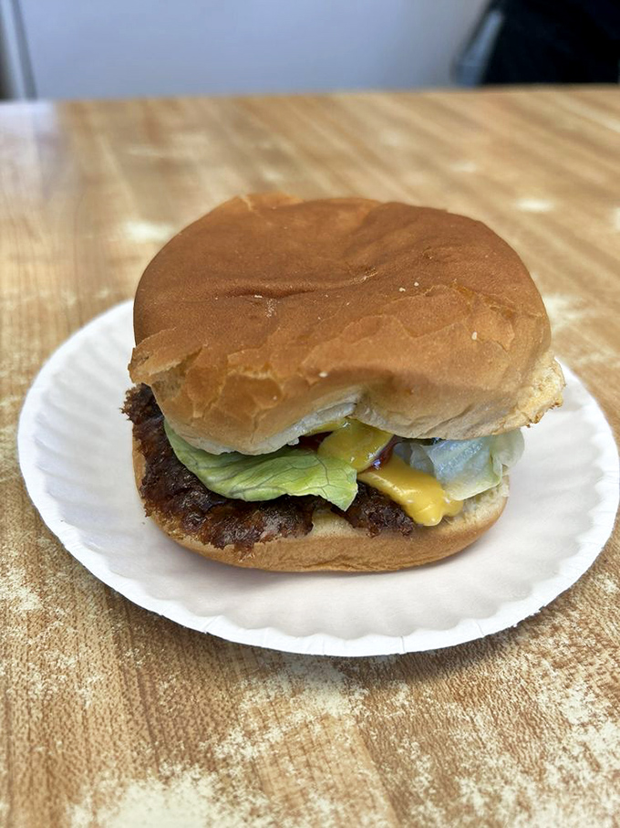 This isn't just a burger; it's a crispy-edged flavor disc that's been making Missourians close their eyes in silent appreciation since Eisenhower was president.