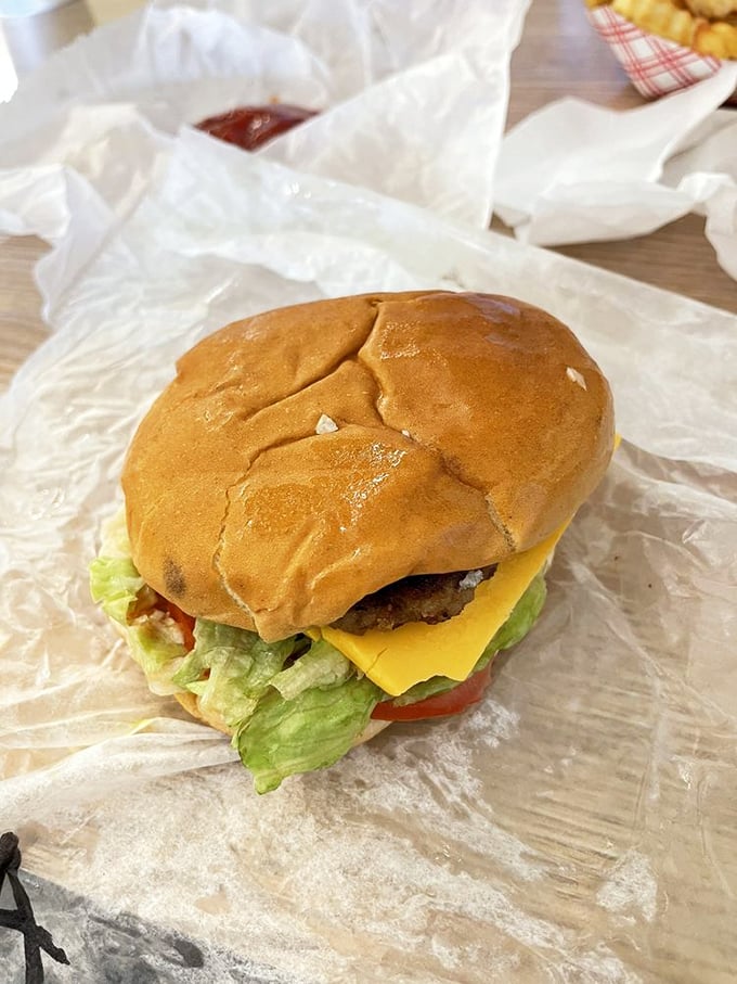 The cheeseburger in its natural habitat: unpretentious, perfectly proportioned, and poised to make you forget every fancy $20 burger you've ever had.