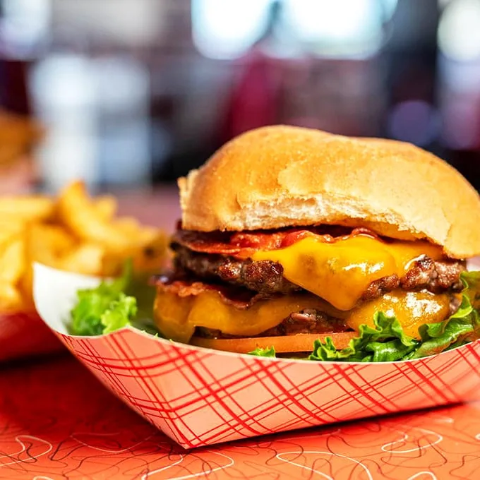 Behold the Double Cheeseburger in its basket-bound glory! Those golden fries aren't just sides, they're supporting actors in this delicious drama.