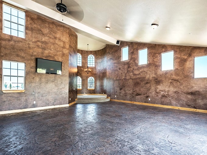 The grand hall's textured walls and soaring windows create a space where medieval charm meets modern comfort. No jousting required, though it would fit right in.
