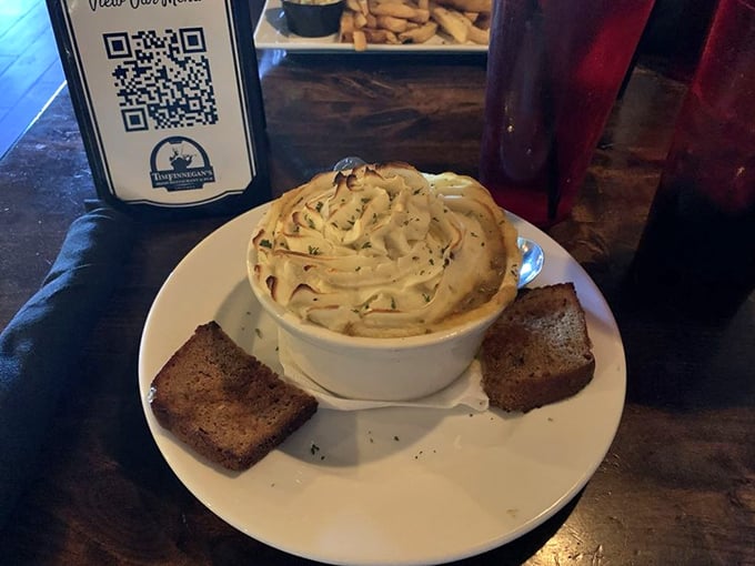 Behold the shepherd's pie masterpiece – golden potato peaks hiding tender lamb treasures that'll ruin you for all others.