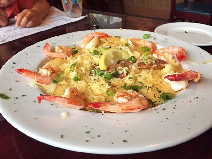 These plump Gulf shrimp rest on a bed of cheesy perfection, with green onions adding that perfect pop of color and freshness.