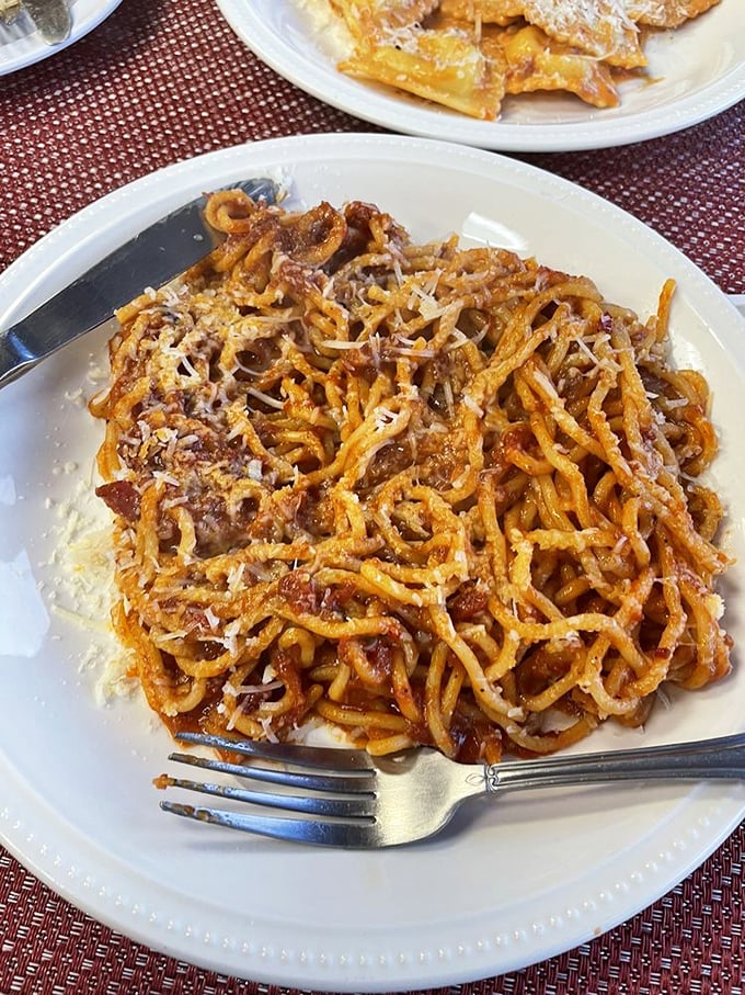 Spaghetti that makes you question every pasta you've eaten before. Those golden strands aren't just noodles—they're edible art.