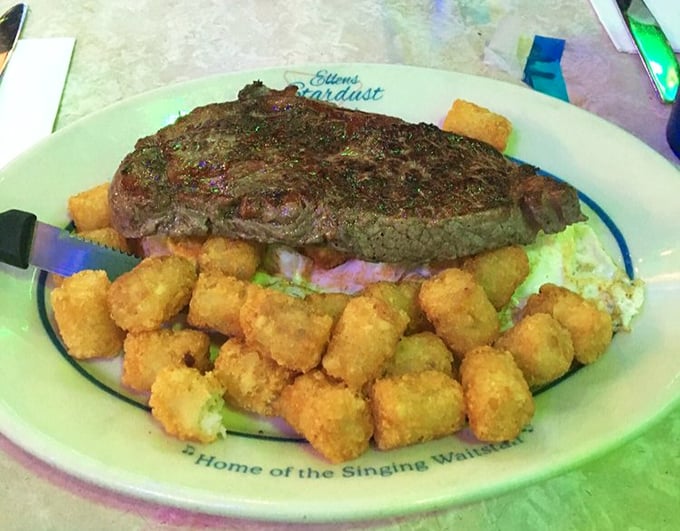This steak doesn't just sizzle—it demands a standing ovation, surrounded by golden tater tots that could understudy as the world's most delicious supporting cast.