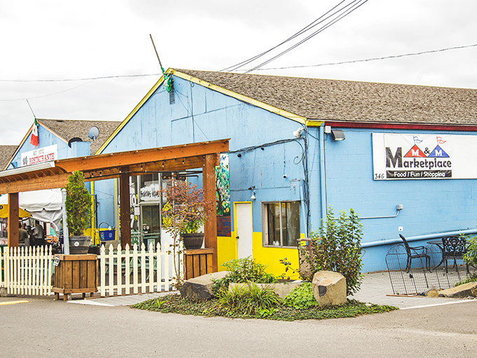 M&M Marketplace's cheerful blue exterior is like a portal to international adventures. No passport required for this cultural journey!