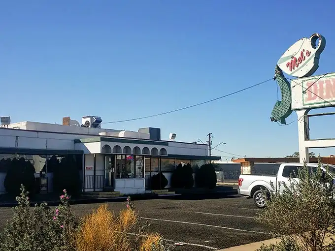 Mel's Diner: That iconic coffee cup sign isn't just decoration – it's a beacon of hope for the caffeine-deprived.