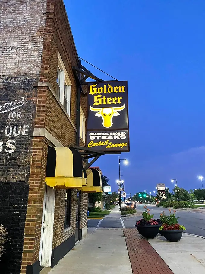 Those black and yellow awnings aren't just for show—they're nature's way of saying "Warning: Addictive steaks ahead!"