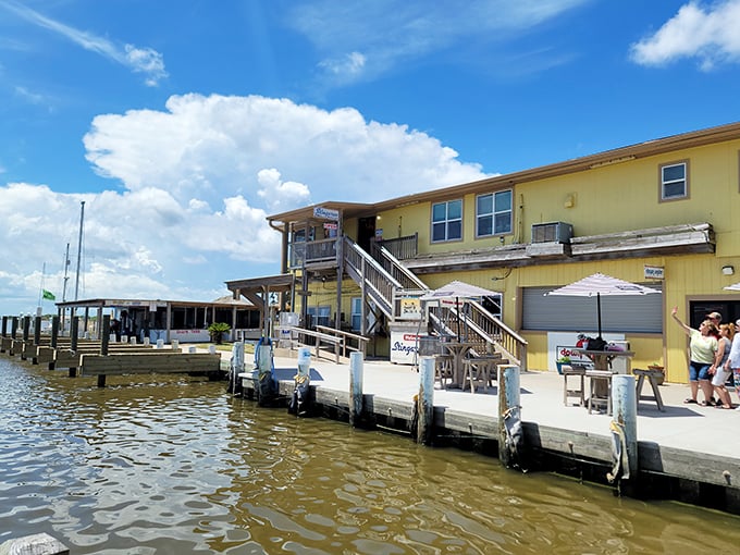 Those wooden docks leading to Stingaree aren't just for boats—they're your pathway to seafood nirvana with a side of sunset views.