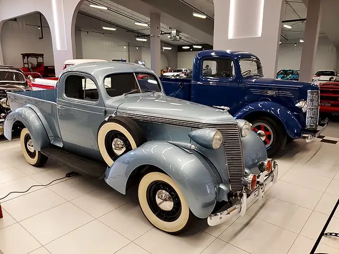 Two classic pickups showing that utility vehicles were never just workhorses – they were rolling sculptures with whitewalls and chrome that happened to haul stuff.