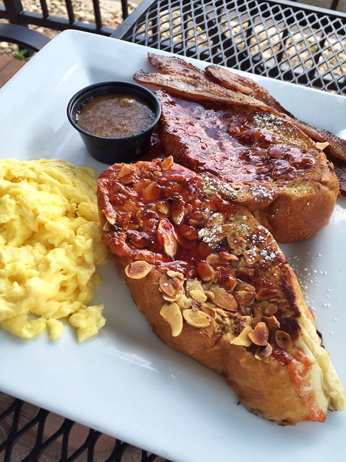 The Almond Three Legion French toast arrives with perfectly scrambled eggs—a breakfast duo that deserves its own morning talk show. 