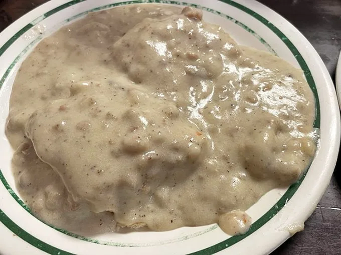 Biscuits and gravy so good they should require a permission slip. This creamy, peppery blanket of comfort doesn't just satisfy hunger—it erases worries.