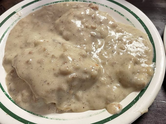Biscuits and gravy that could make your grandmother jealous—a creamy, peppery blanket covering pillowy biscuits that deserve their own fan club.