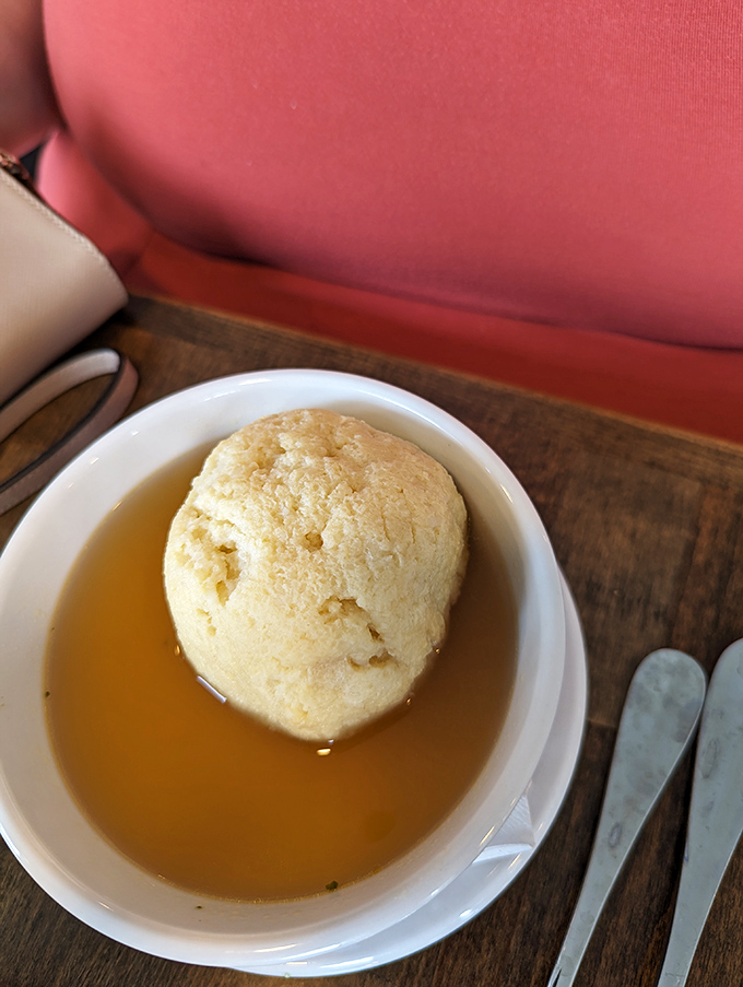 This matzo ball doesn't float—it commands respect. Like the Death Star of comfort food, but with better seasoning and no evil empire.