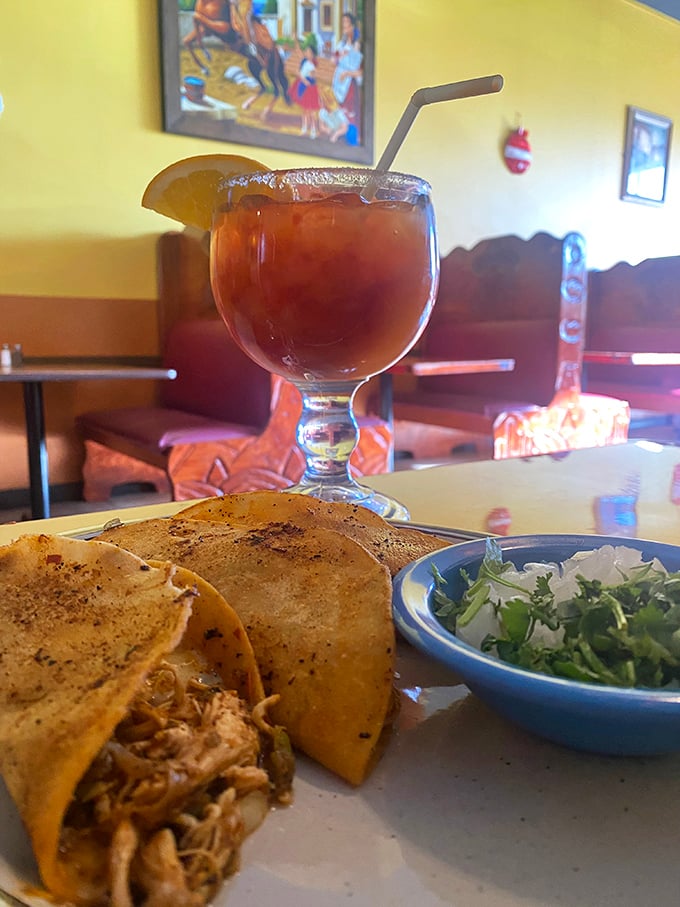 That golden goblet isn't just holding a margarita—it's guarding the true treasure: perfectly crisped birria tacos waiting to be dunked.