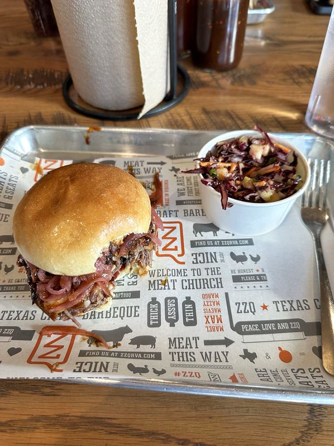 This isn't just a sandwich—it's architecture. Layers of smoky meat and pickled red onions create a skyscraper of flavor that demands a two-handed salute.