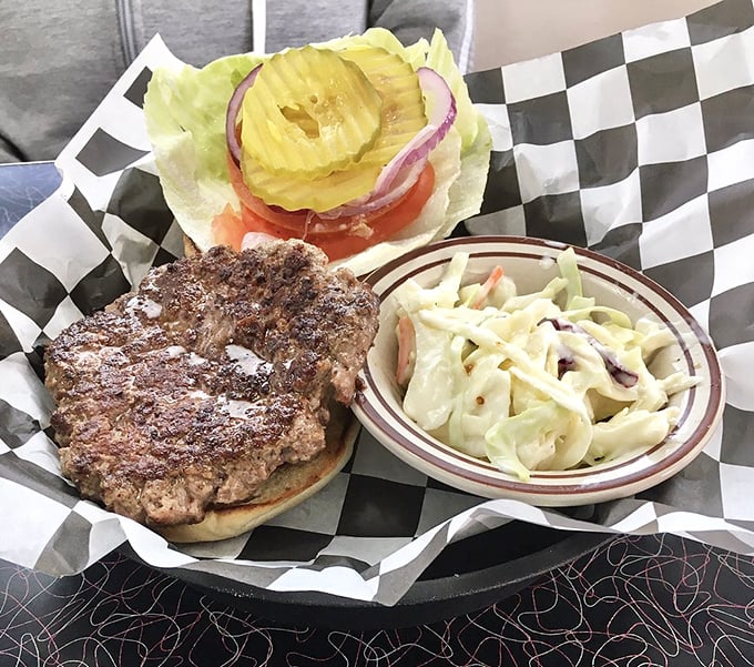 This isn't just a burger, it's architectural perfection—hand-formed patty with a slight crust, fresh toppings, and coleslaw that isn't an afterthought.