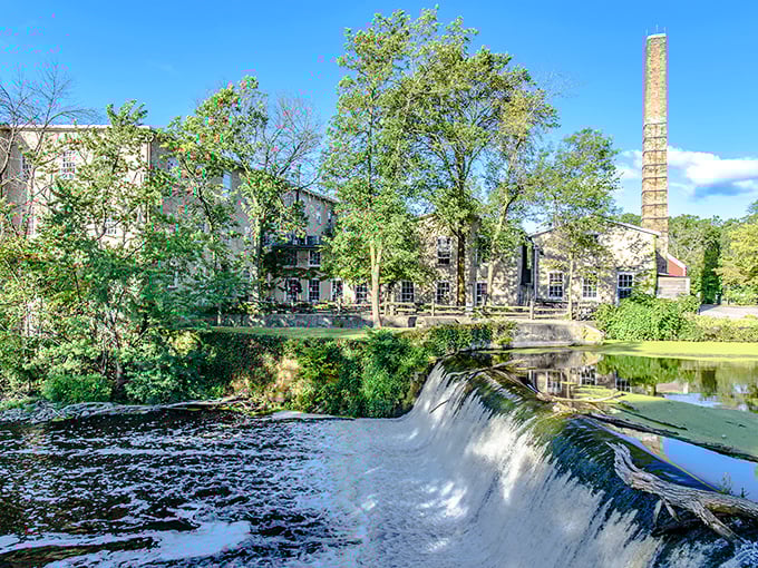 Where limestone meets waterfall, Cedar Creek's historic mill complex proves industrial buildings can age like fine wine—and actually produce it too.
