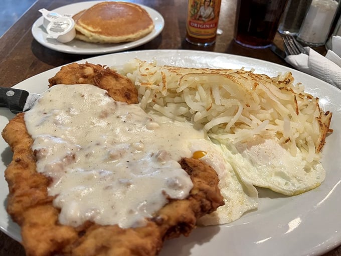 Breakfast of champions: crispy-edged chicken fried steak meets perfectly crisped hash browns and sunny-side-up eggs – the holy trinity of morning indulgence.