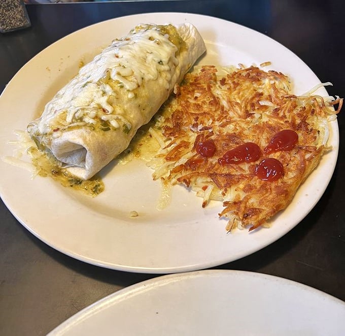 The burrito's sophisticated cousin—a perfectly wrapped omelet—shares the plate with hash browns sporting the kind of bronze tan Texans appreciate.