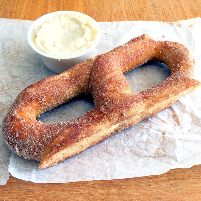 Cinnamon sugar pretzel with cream cheese dip: dessert masquerading as a snack. Your sweet tooth just found its soulmate.