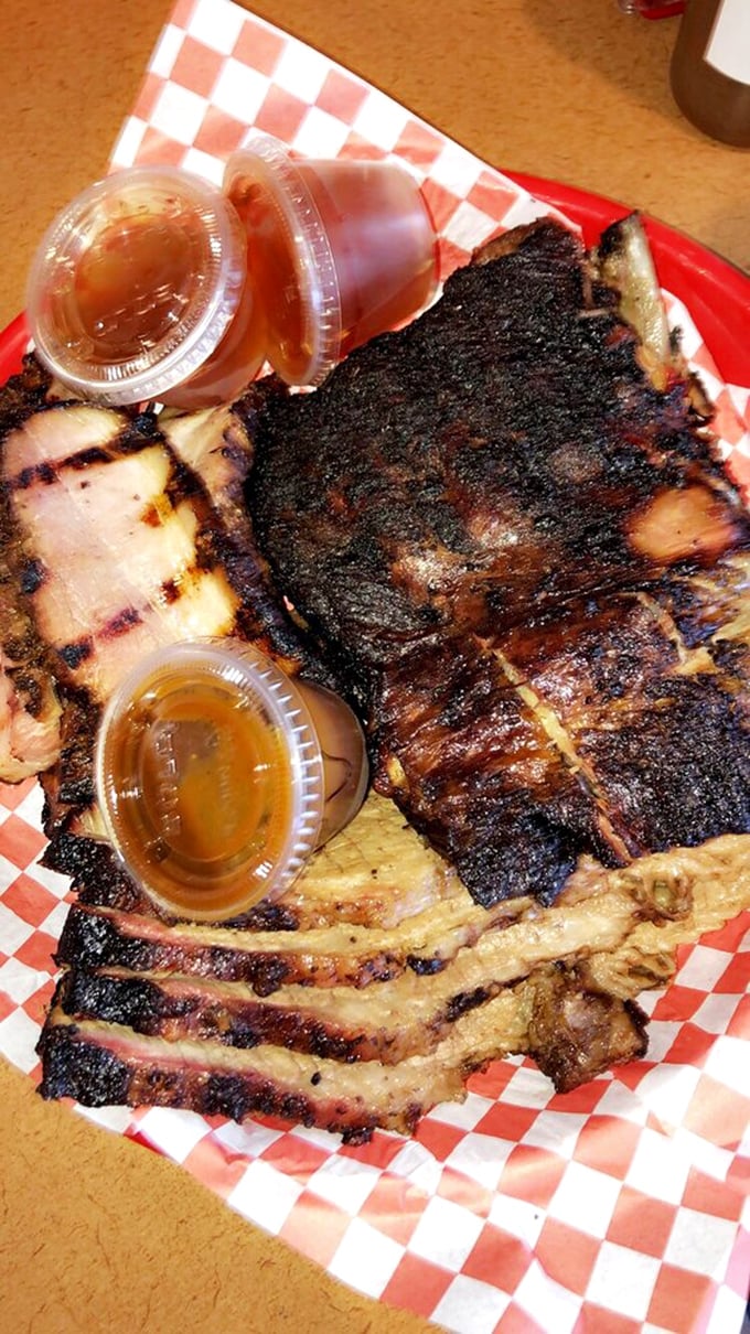 A meat portfolio more diverse than my retirement account. Those sauce cups aren't accessories—they're essential flavor investments.