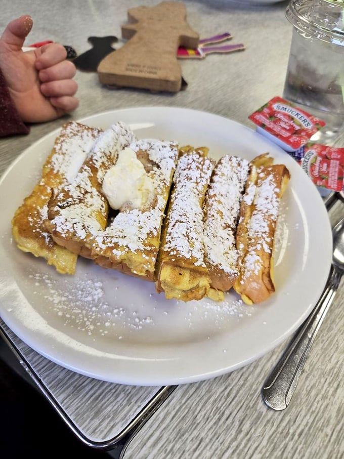 French toast soldiers lined up and dusted with powdered sugar like they're wearing winter coats. That dollop of butter melting in the middle is the sun rising on your morning.
