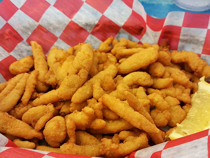 Fried clam strips that crunch like autumn leaves but taste like summer vacation. The perfect ratio of crispy coating to tender clam—a textural masterpiece.