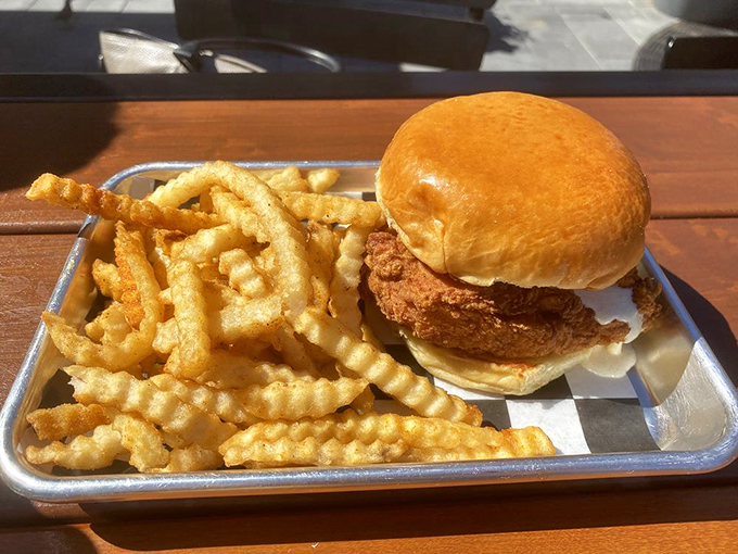 The classic chicken sandwich gets the royal treatment—crispy exterior, pillowy bun, and those waffle fries deserve their own fan club.