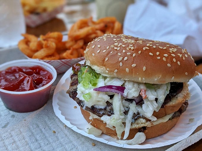 A double-decker masterpiece with all the fixings. That cascade of fresh toppings isn't just garnish—it's an essential part of the Jumpin' Jack's experience.