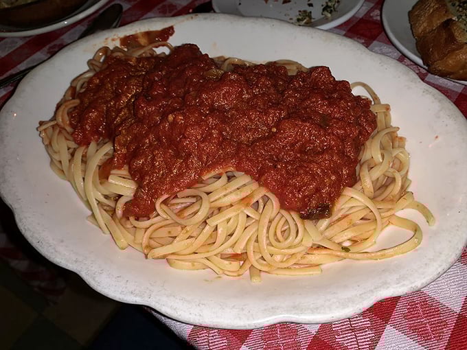 Linguine that's seen the business end of a proper meat sauce. This plate doesn't just satisfy hunger—it creates lifelong memories and sauce-stained shirts.