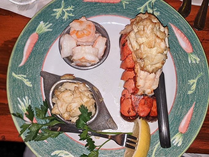 The holy trinity of seafood perfection: a succulent lobster tail, plump shrimp, and delicate crab meat—a plate that makes you want to send thank-you notes to the ocean.
