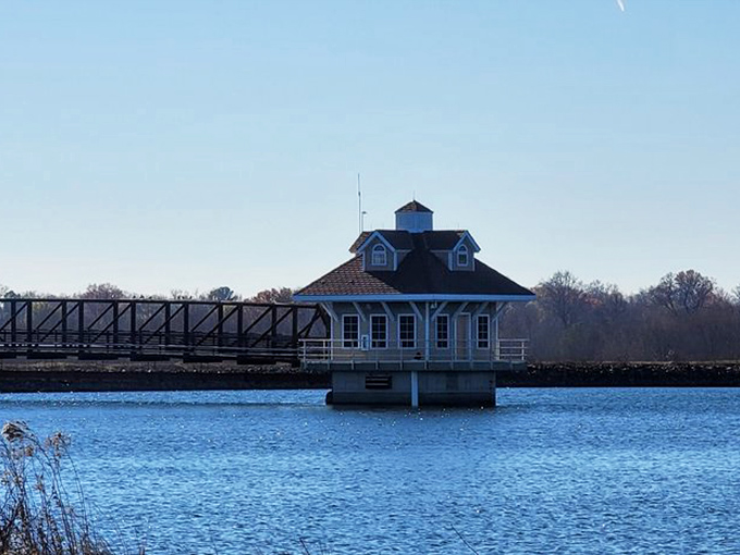 The Newark Reservoir's charming pump house seems to float on water, offering a peaceful retreat from antiquing adventures.
