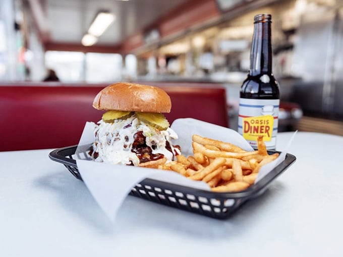 This burger looks like it's auditioning for a food commercial, with cheese melting like a Salvador Dalí painting and fries standing by for moral support.
