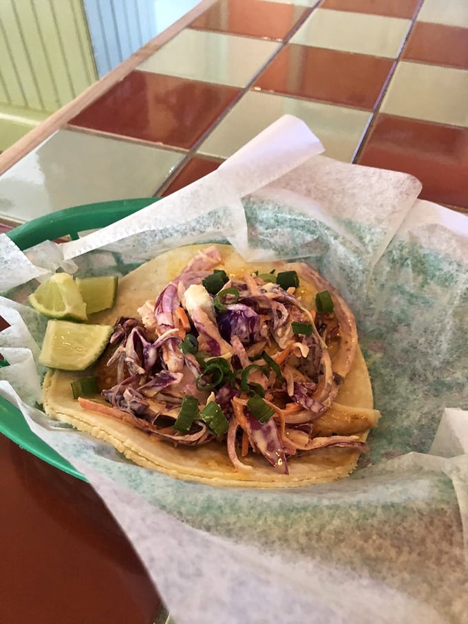 The Okie-Wahoo isn't just a taco—it's Oklahoma's answer to coastal cuisine, with slaw that crackles with each delightful bite.