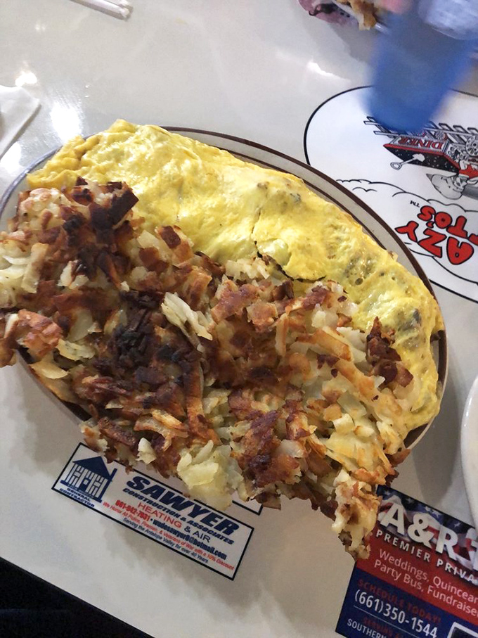 This isn't just breakfast—it's breakfast with ambition. Crazy Otto's omelets arrive with a side of "good luck finishing this before lunch."