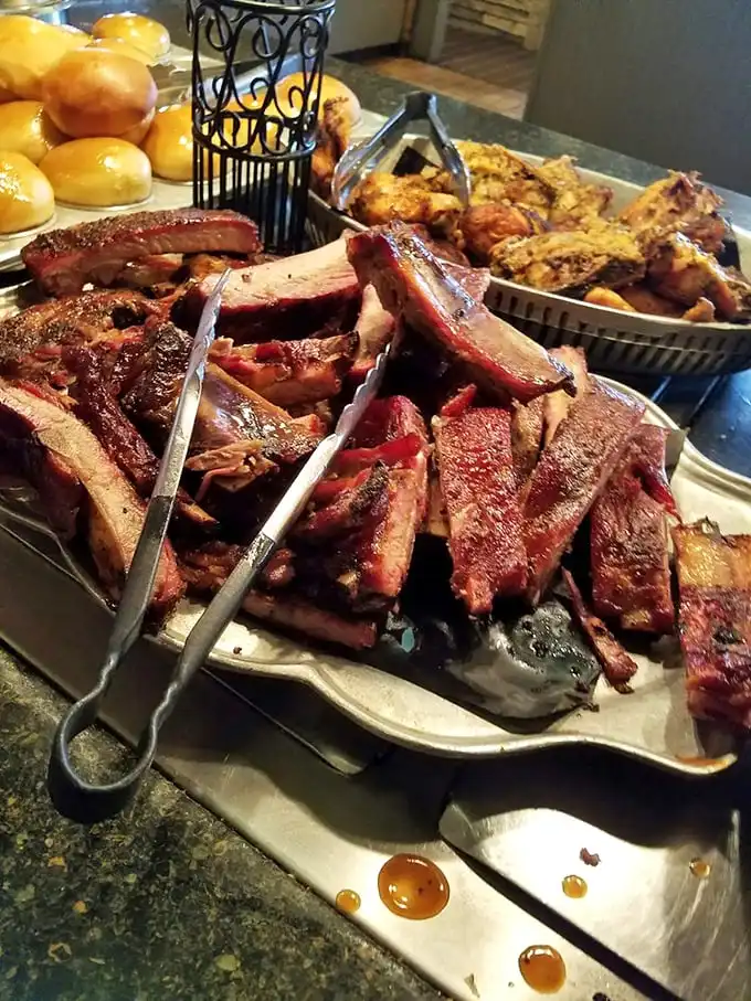 These ribs aren't falling off the bone—they're voluntarily jumping into your mouth. Smoky, sticky, and worth every napkin.