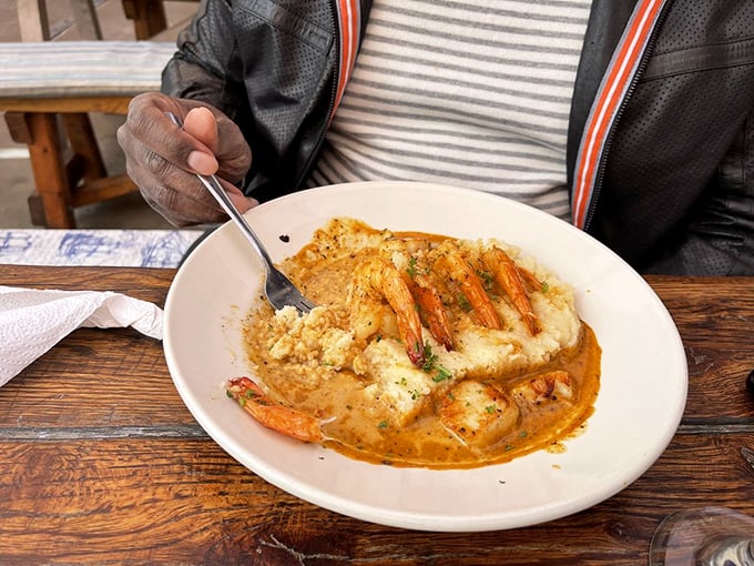 Shrimp and grits that would make a Southerner weep with joy. Plump crustaceans lounging on creamy cornmeal like they're at a five-star resort.