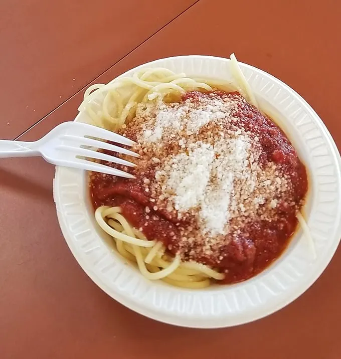 This isn't just spaghetti, it's a generous helping of nostalgia topped with enough grated cheese to make your cardiologist wince—and worth every bite.