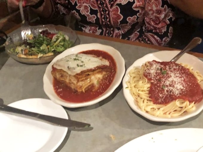 The holy trinity of Italian comfort: garden salad, lasagna, and spaghetti with marinara – a meal that feels like a warm hug.