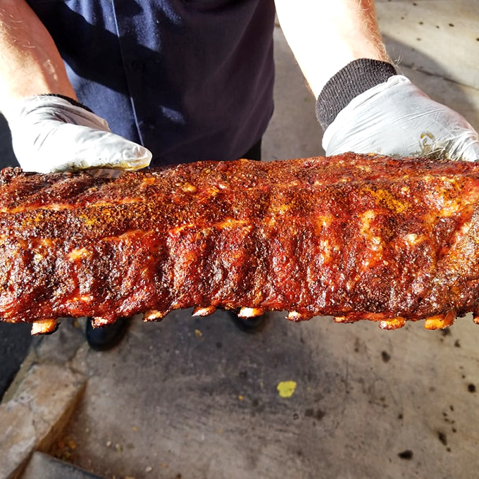 Behold the rack that launched a thousand road trips. That bark, that color—it's the Sistine Chapel of smoked meat artistry.