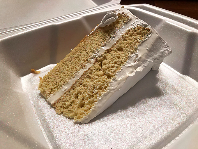 A perfect cross-section reveals the cake's secret—somehow magically soaked yet maintaining its structure. Engineering at its most delicious.