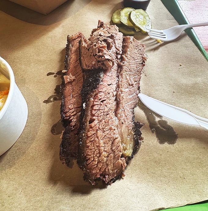 Sliced brisket with that glistening pepper crust is the jewelry of the barbecue world—except this bling disappears with delicious urgency. 